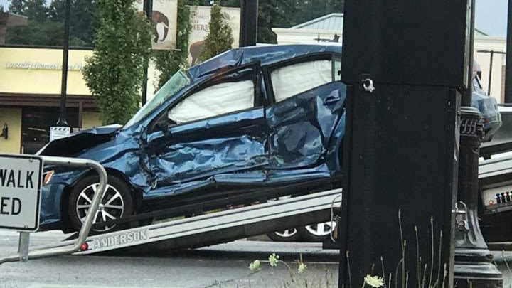 Four injured in crash between ambulance, car | kgw.com